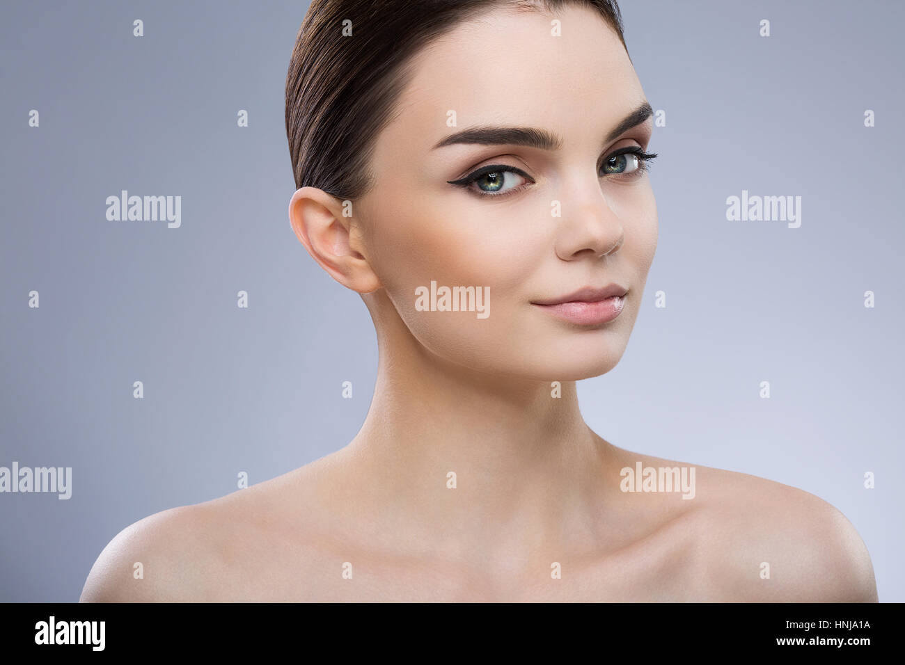Lovely model at gray background Stock Photo - Alamy
