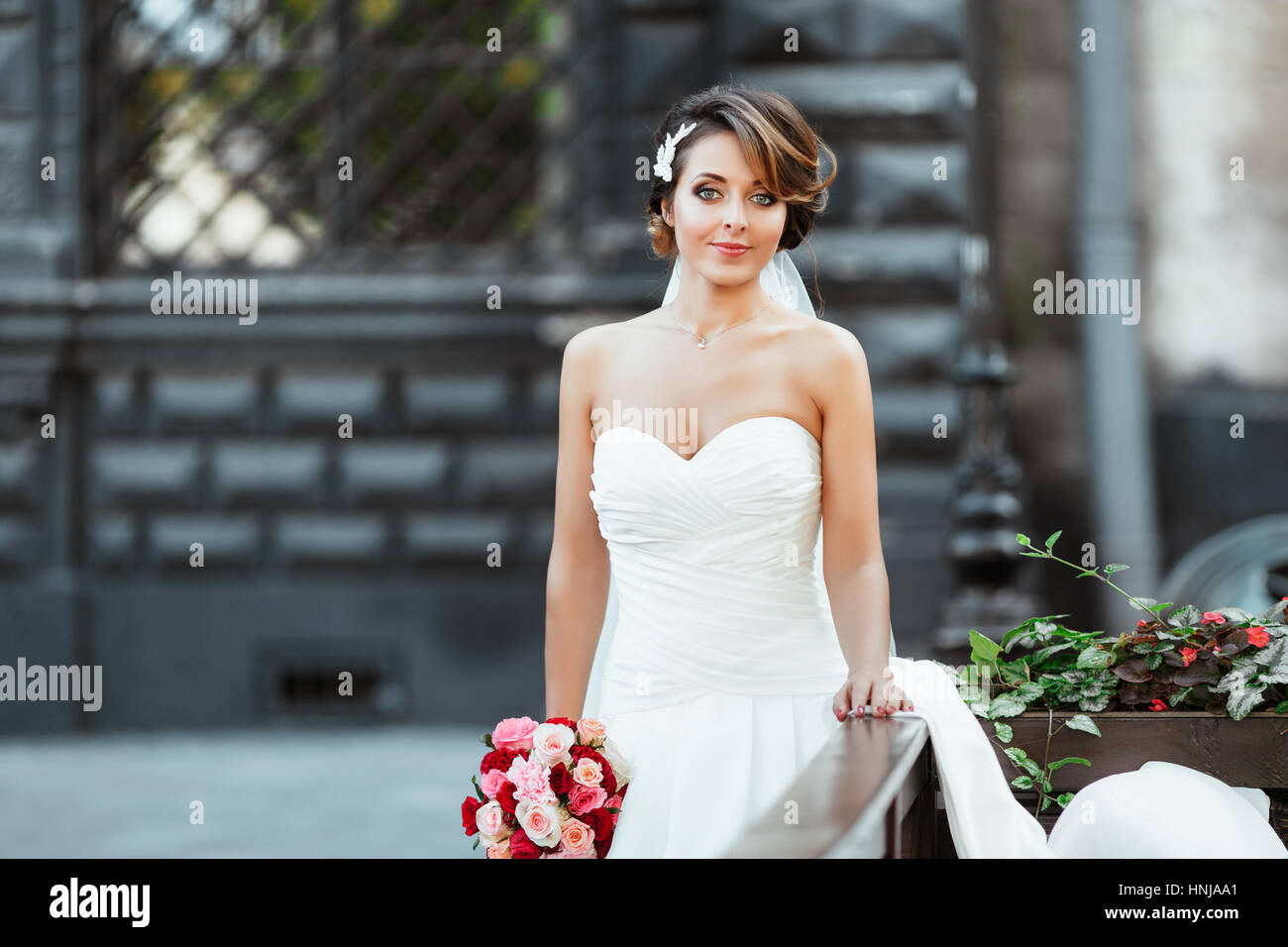Bride standing outdoor Stock Photo - Alamy