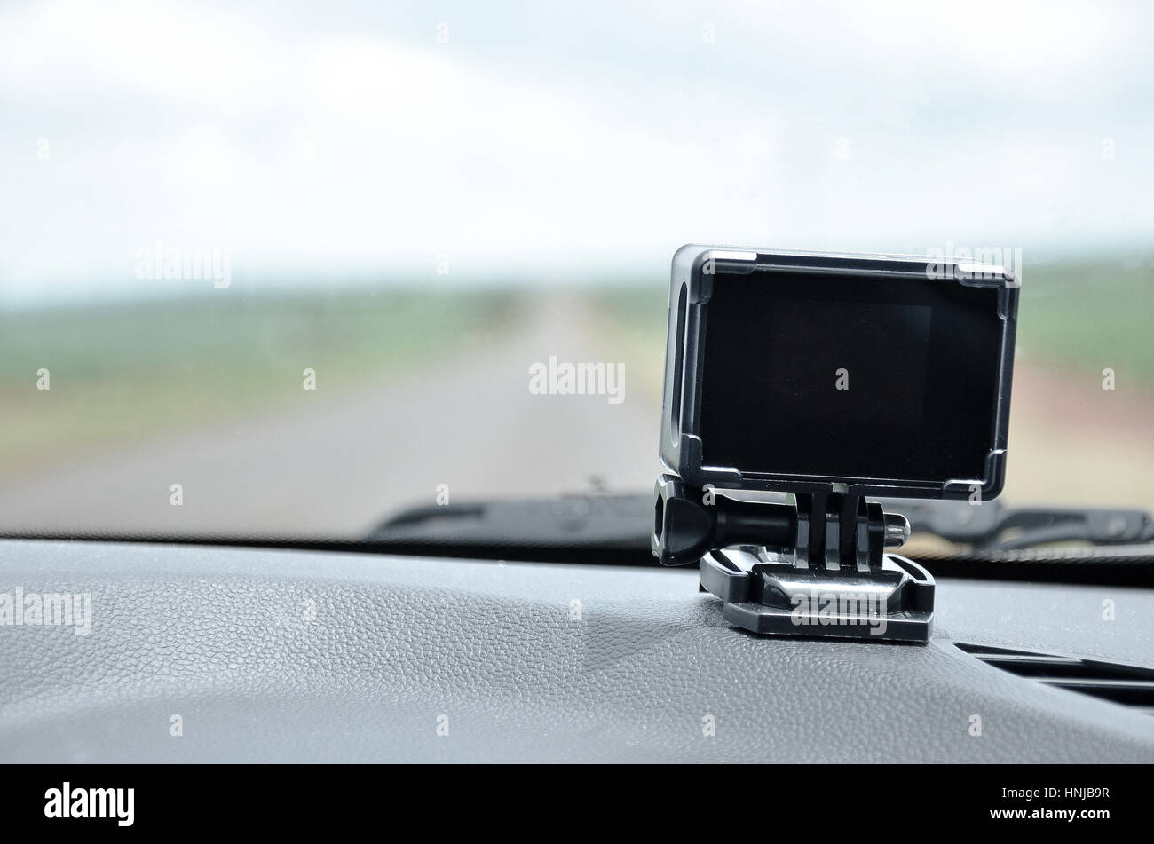 Mini camera fixed to the car dashboard Stock Photo - Alamy