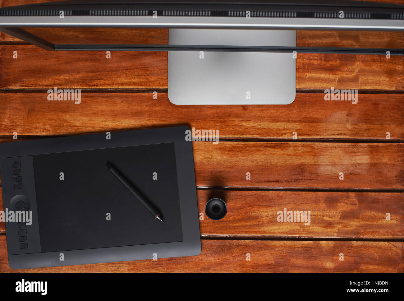 office wooden desk of graphic designer with PC and graphic tablet copy ...