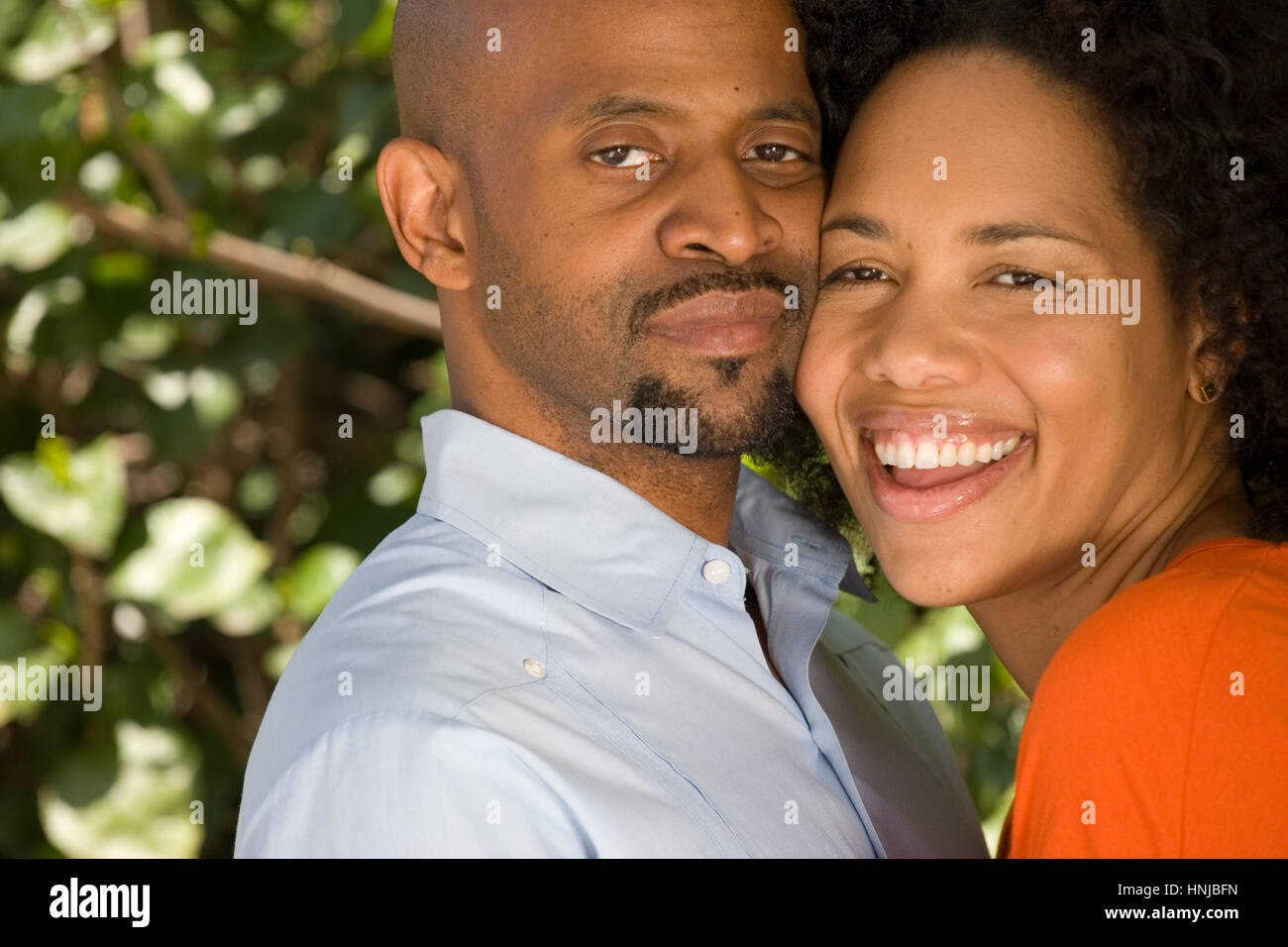 Romantic African American couple hugging outside Stock Photo - Alamy