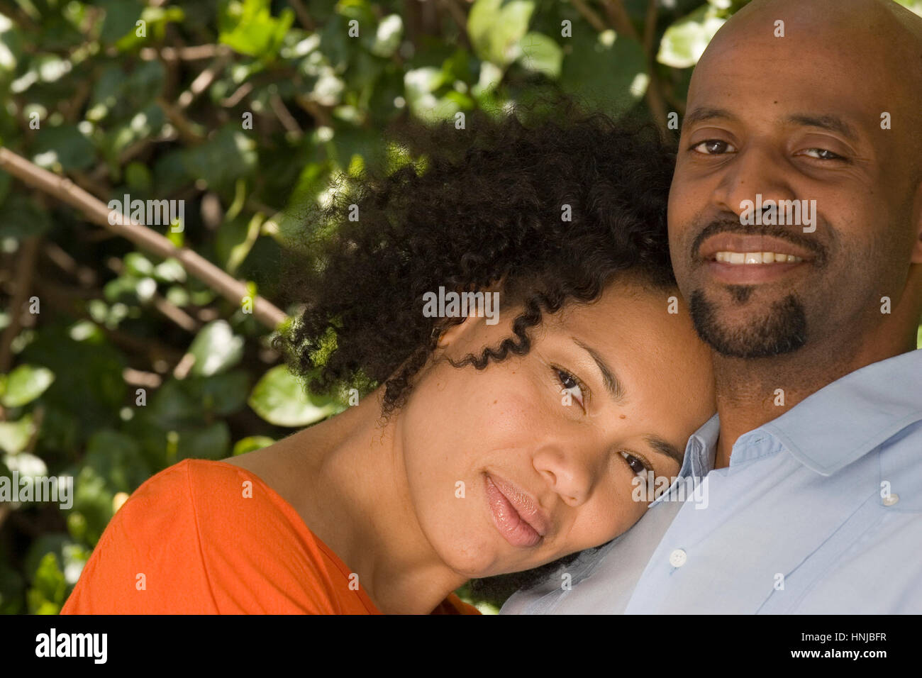 Romantic African American couple hugging outside Stock Photo - Alamy