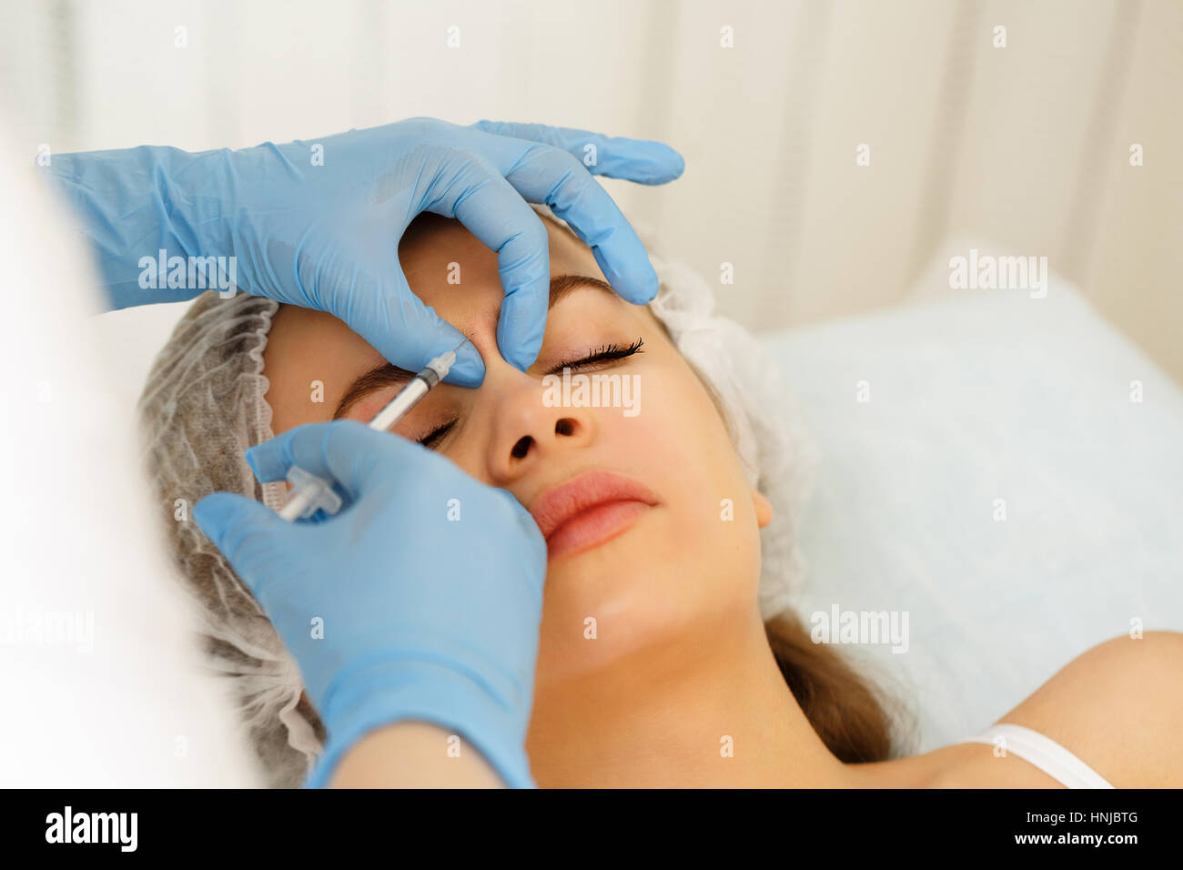 Injections under the skin. The injection into skin folds on the nose ...