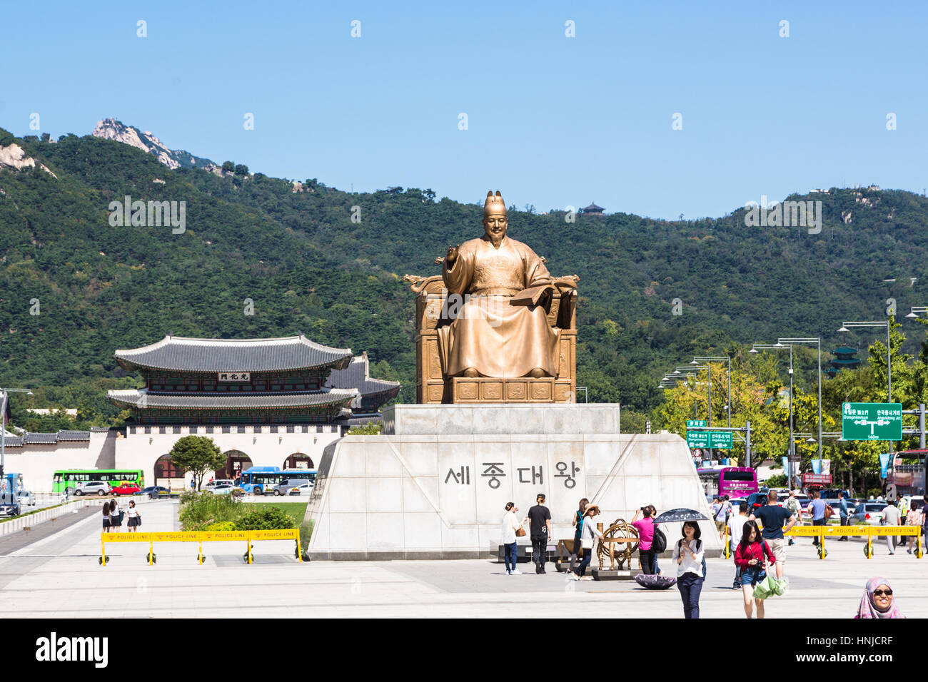SEOUL, SOUTH KOREA : People wander around the King Sejong Statue in the ...