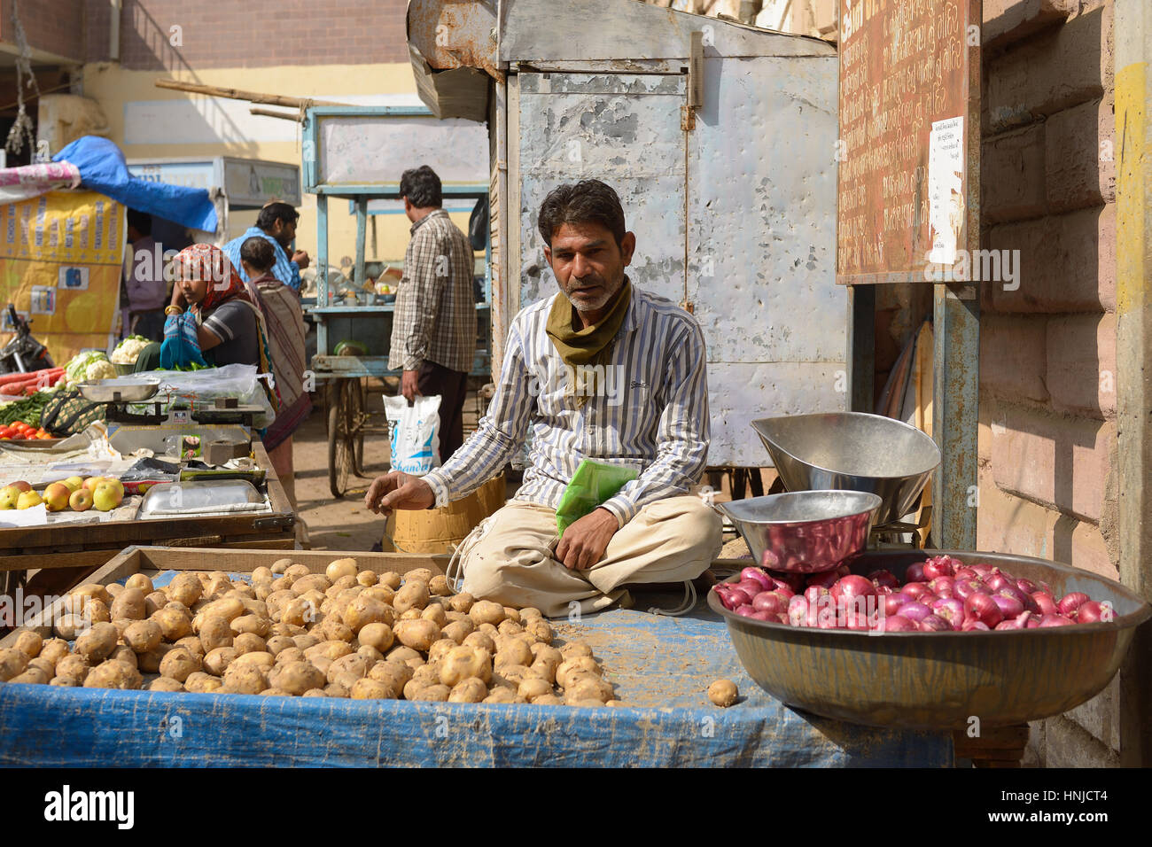 BHUJ, GUJARAT, INDIA - JANUARY 15: Seller of vegetables from carts in ...