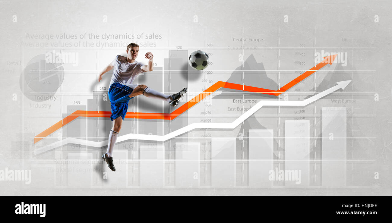 Football player kicking ball and graphs at background. Mixed media ...