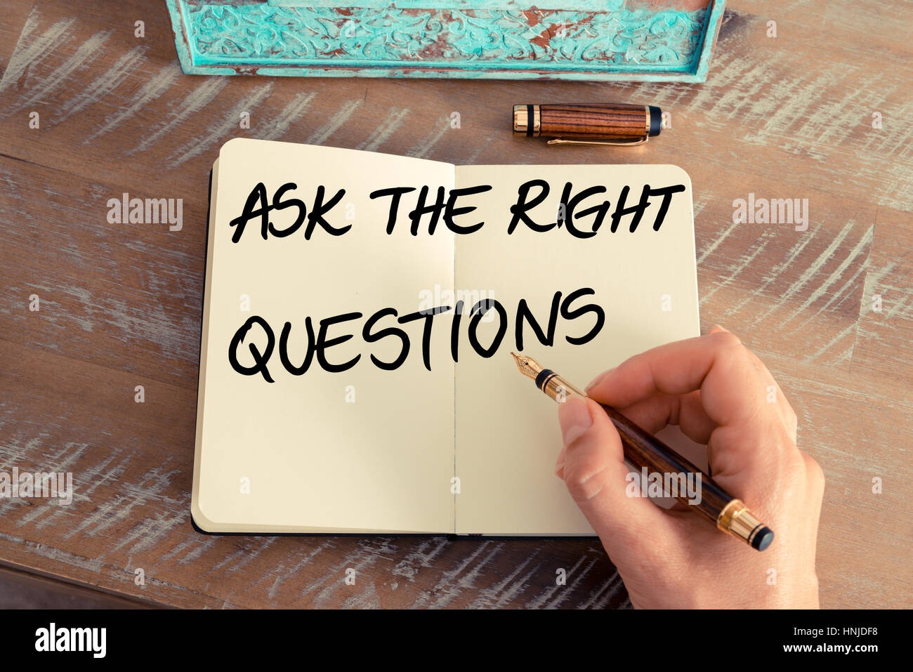 Retro effect and toned image of a woman hand writing a note with a ...