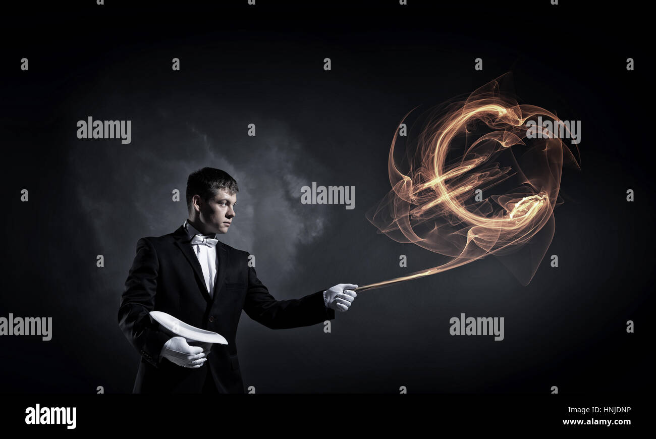 Man magician with cylinder hat doing tricks Stock Photo - Alamy