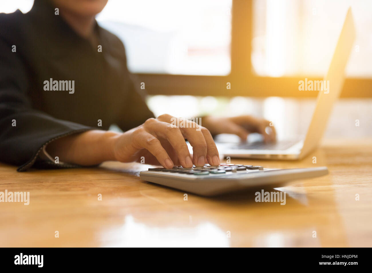 accountant working with calculator and computer laptop on office desk ...