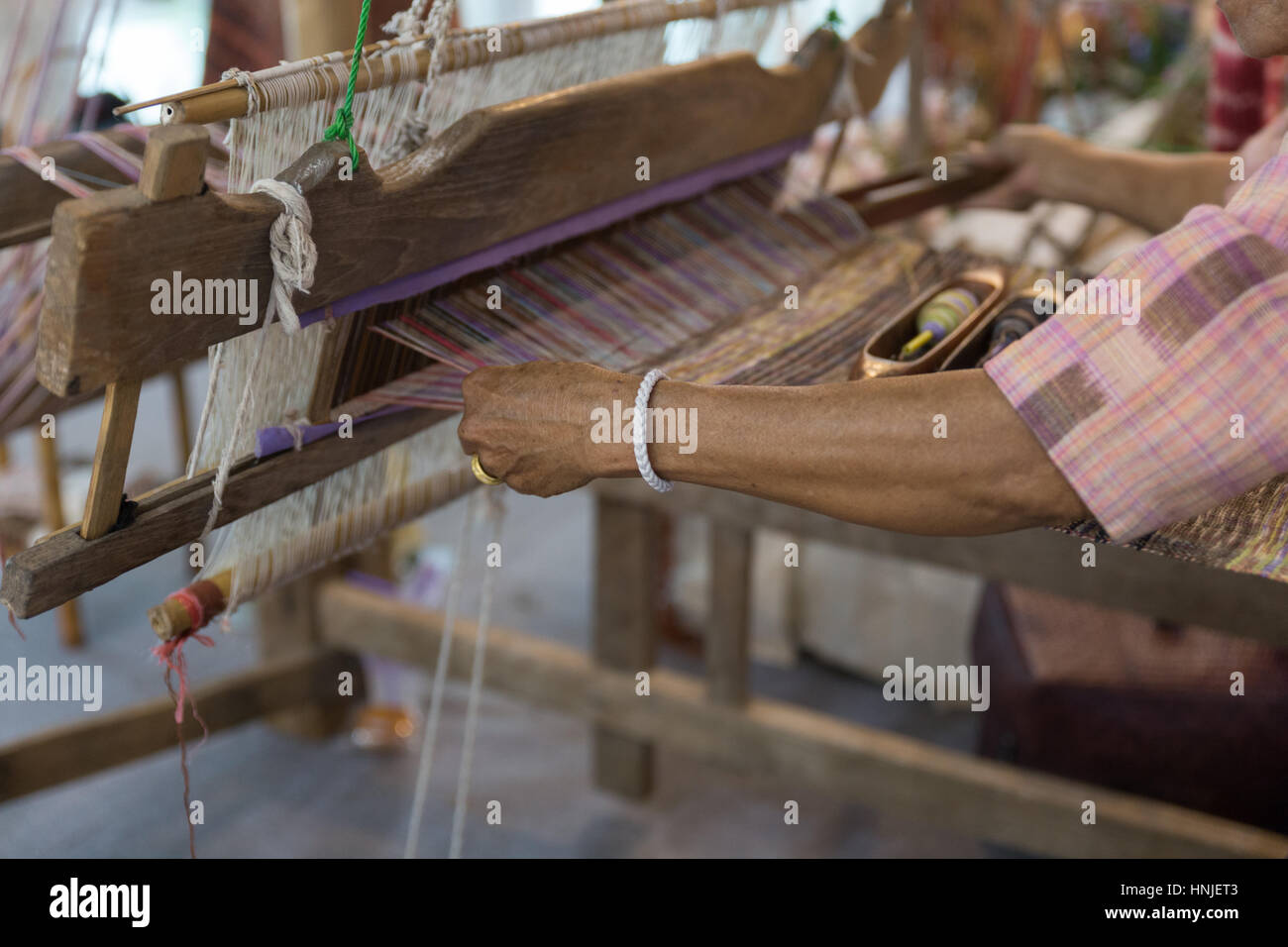 traditional hand-weaving loom being used to make cloth Stock Photo - Alamy