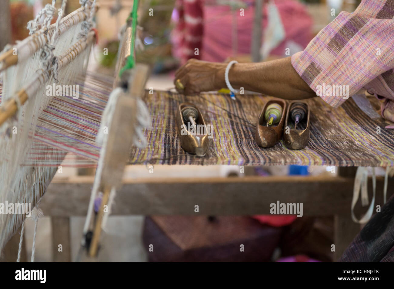 traditional hand-weaving loom being used to make cloth Stock Photo - Alamy