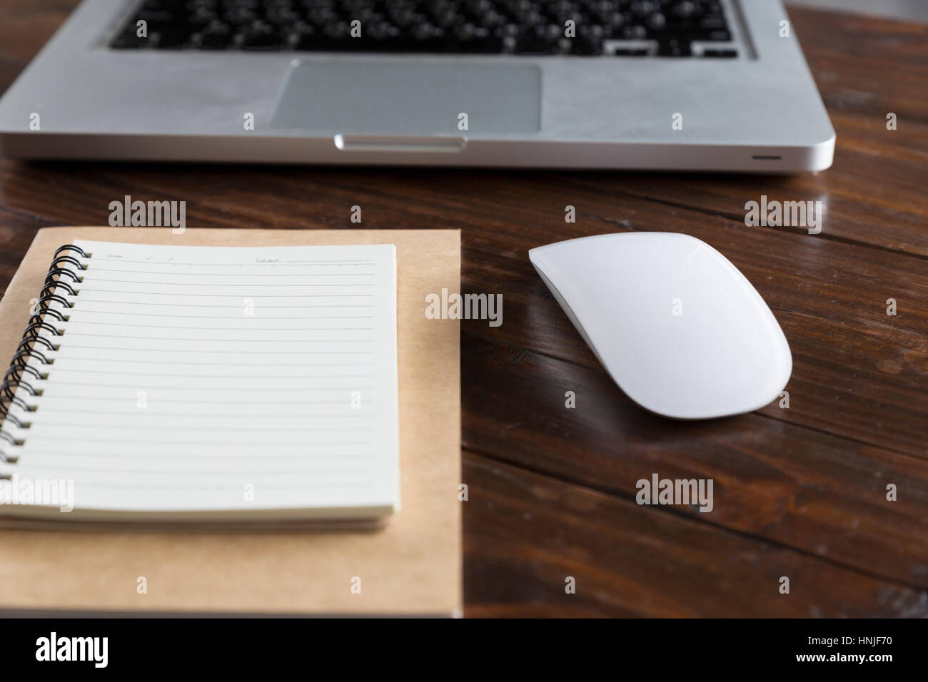 laptop computer and notebook on wooden office desk Stock Photo - Alamy