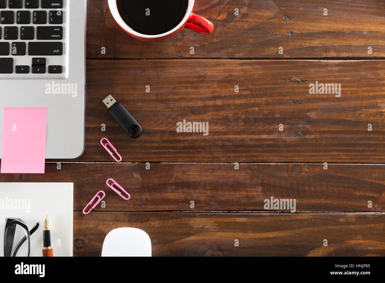 laptop computer, pen and notepad on wooden office desk - top view Stock ...