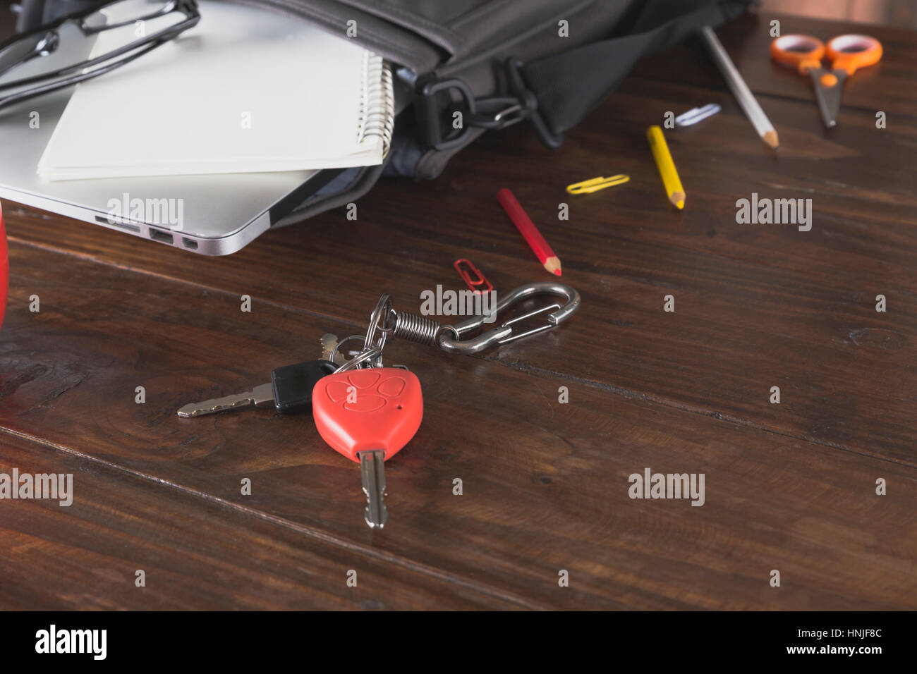 car key, laptop computer and notebook on wooden office desk Stock Photo ...
