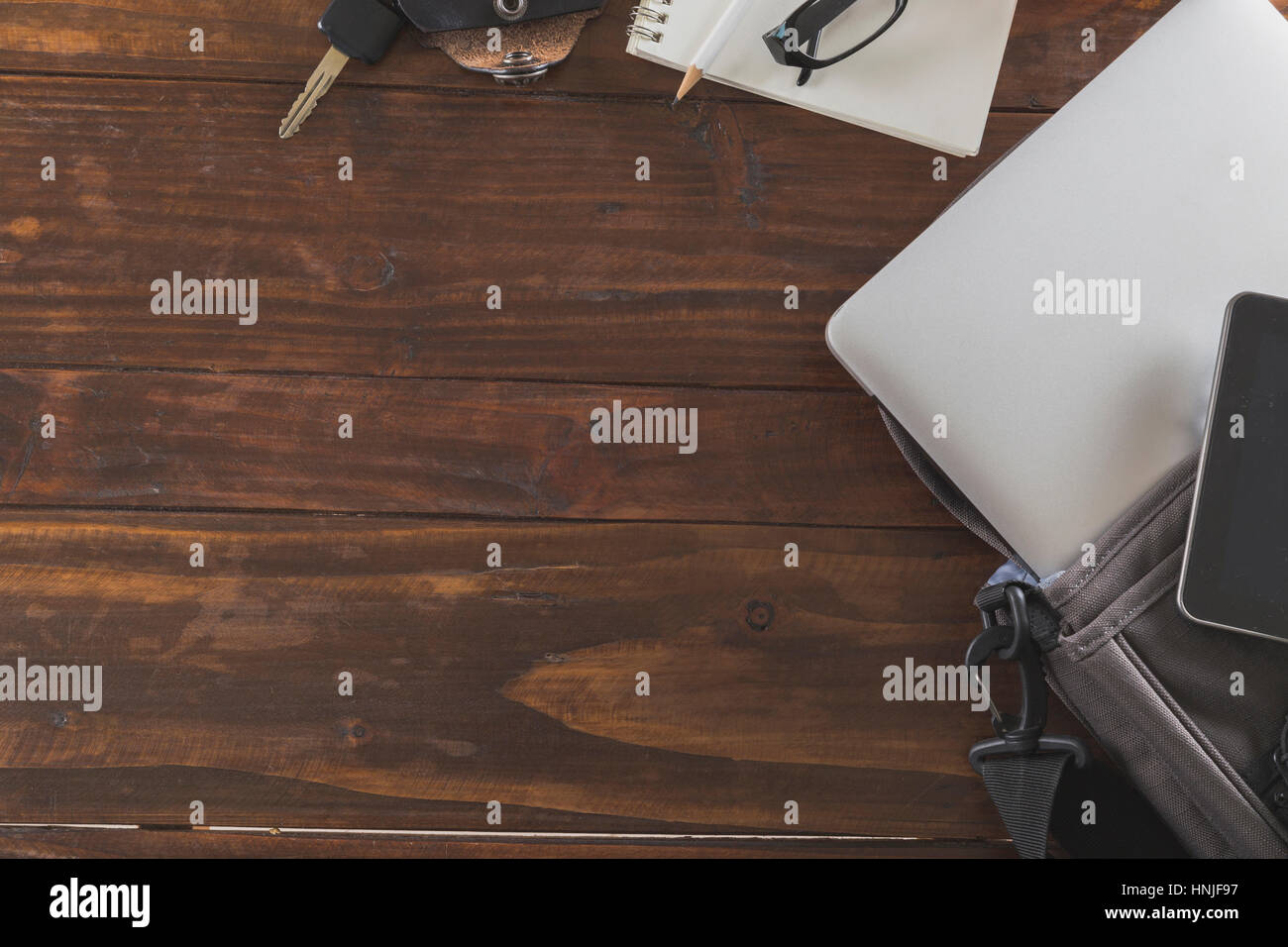 car key, laptop computer and tablet on wooden office desk - top view ...