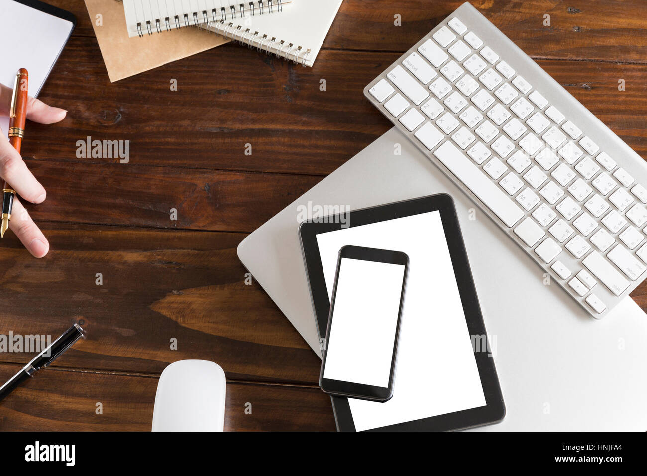 mobile phone, tablet and laptop computer on wooden office desk Stock ...