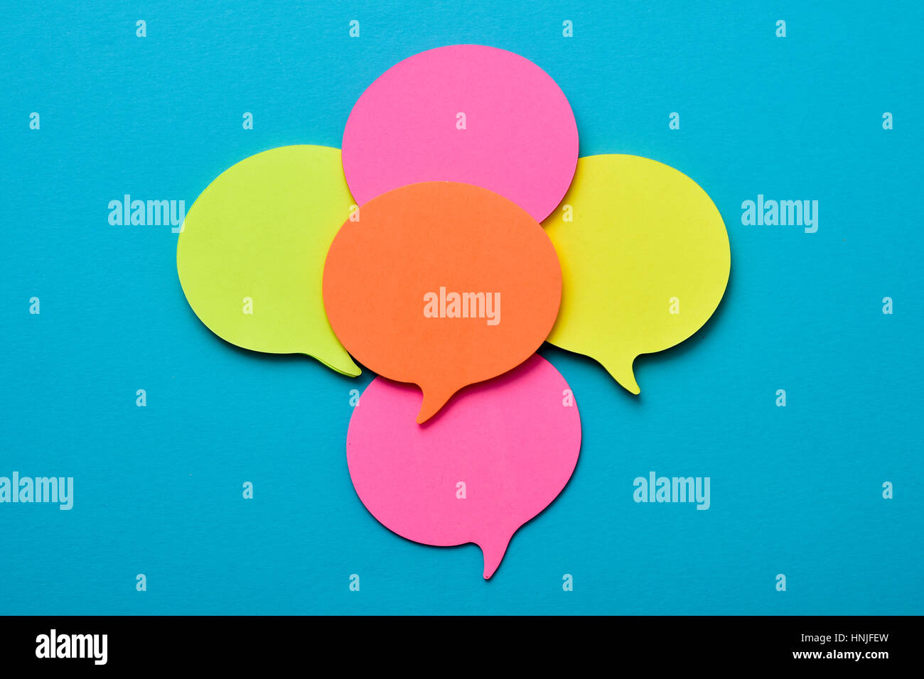 a pile of sticky notes sticky notes in the shape of speech balloons of ...