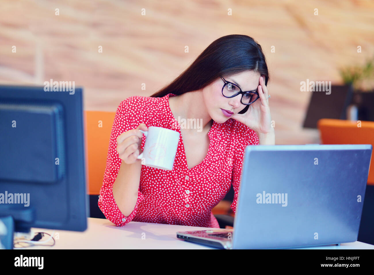Tired overworked businesswoman at office covering her face with hands ...