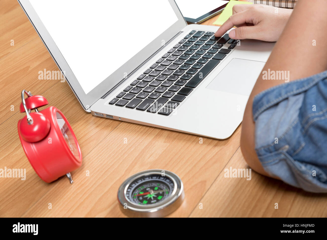 hand typing on computer notebook with red clock on office desk Stock ...