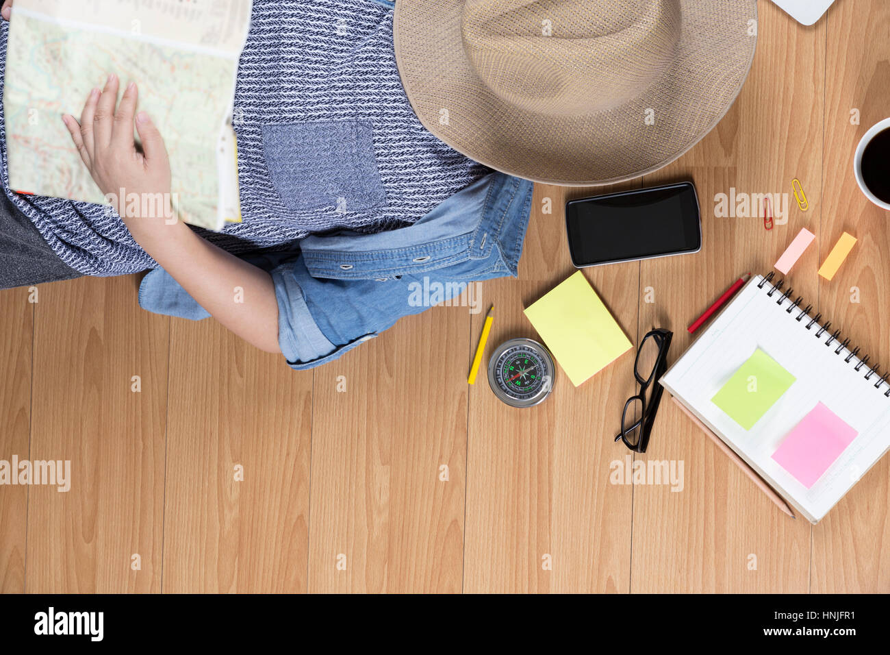 Woman lying with map hi-res stock photography and images - Alamy