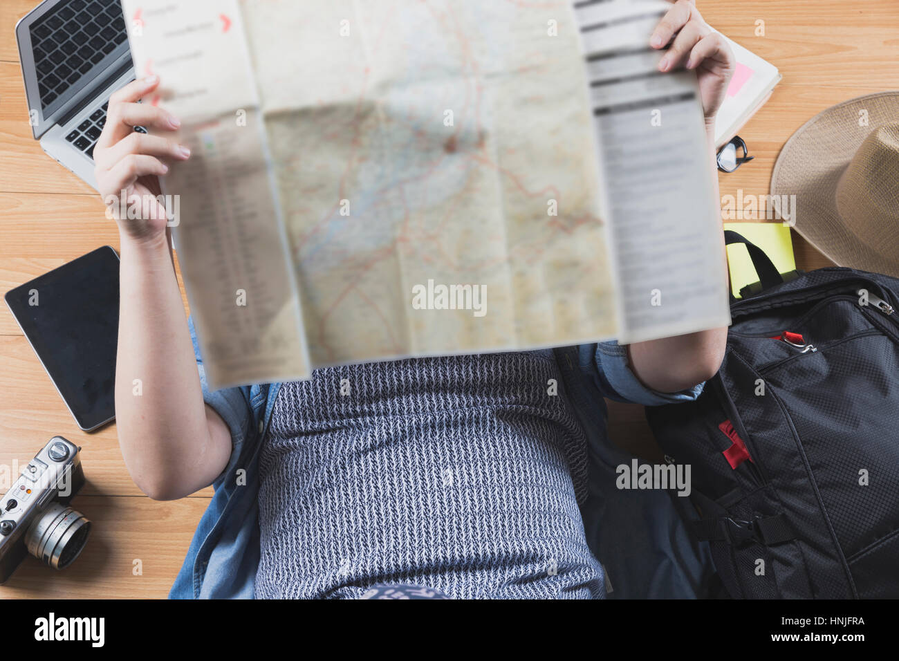 Woman lying with map hi-res stock photography and images - Alamy