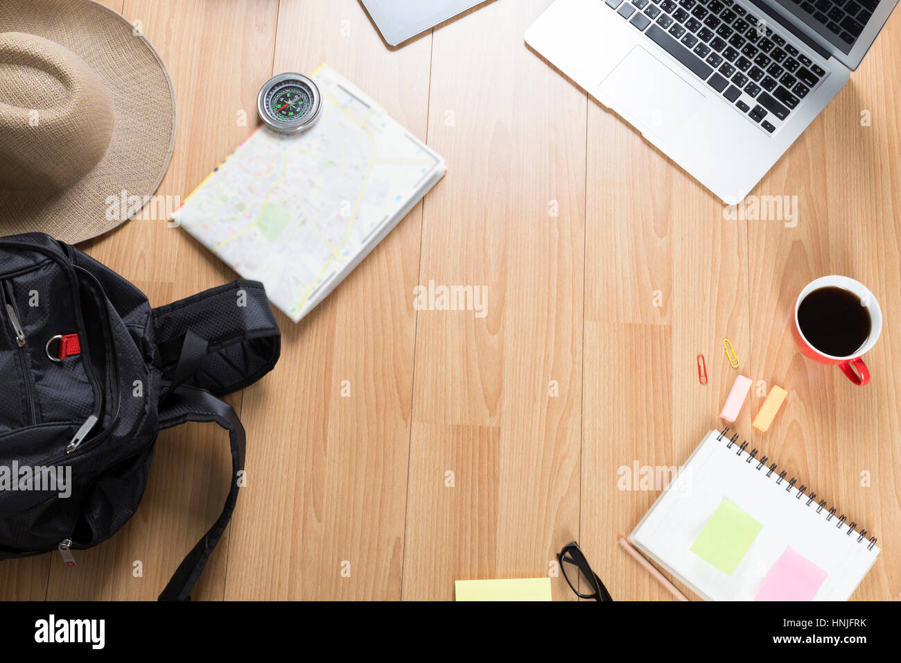 computer notebook, notepad and backpack on wooden desk Stock Photo - Alamy