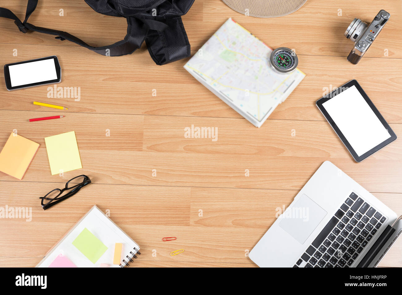 computer notebook, notepad and map on wooden desk Stock Photo - Alamy