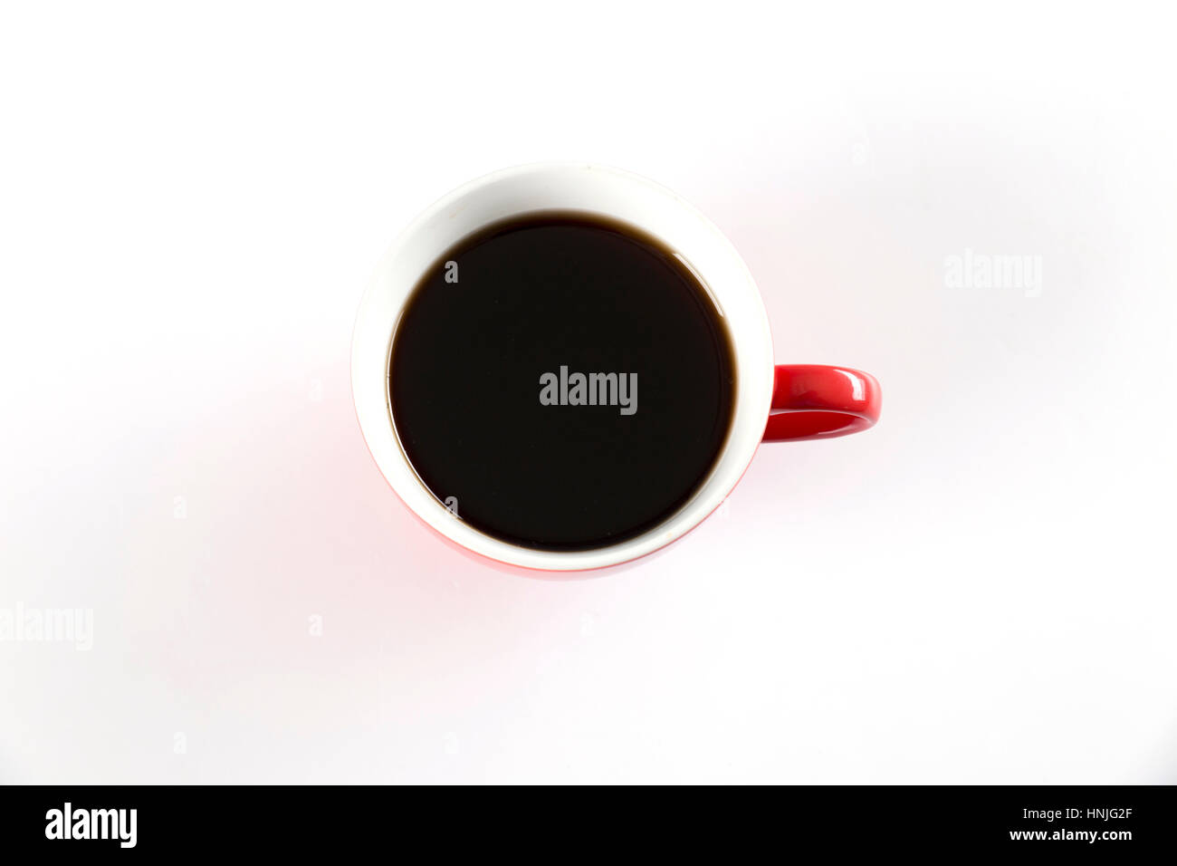 red coffee cup on white background - top view Stock Photo - Alamy