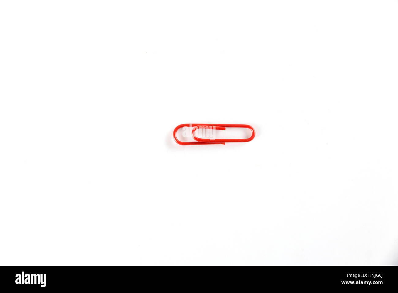 red paper clip on white background Stock Photo - Alamy