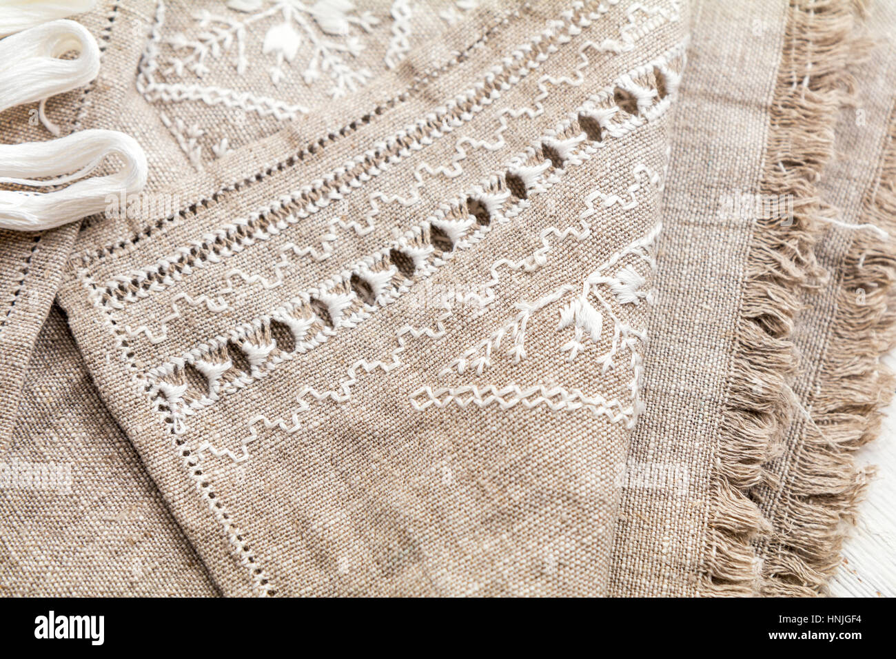 Embroidery background. Linen with needlework in progress. Coloring and ...