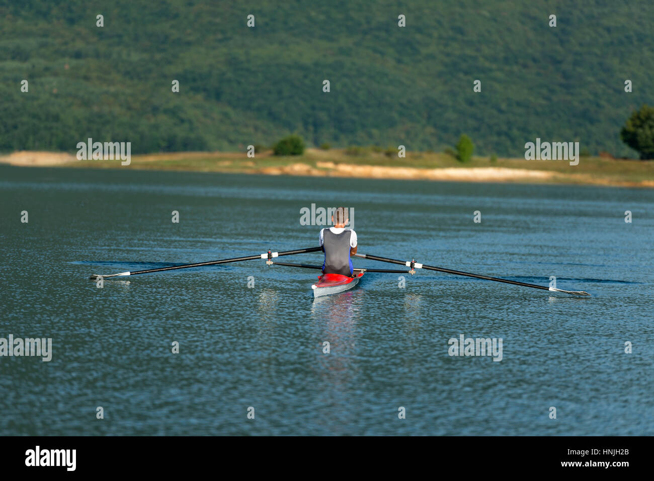 Child in the course of rowing on single Stock Photo - Alamy