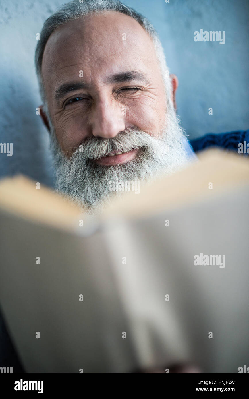 Man reading book Stock Photo - Alamy