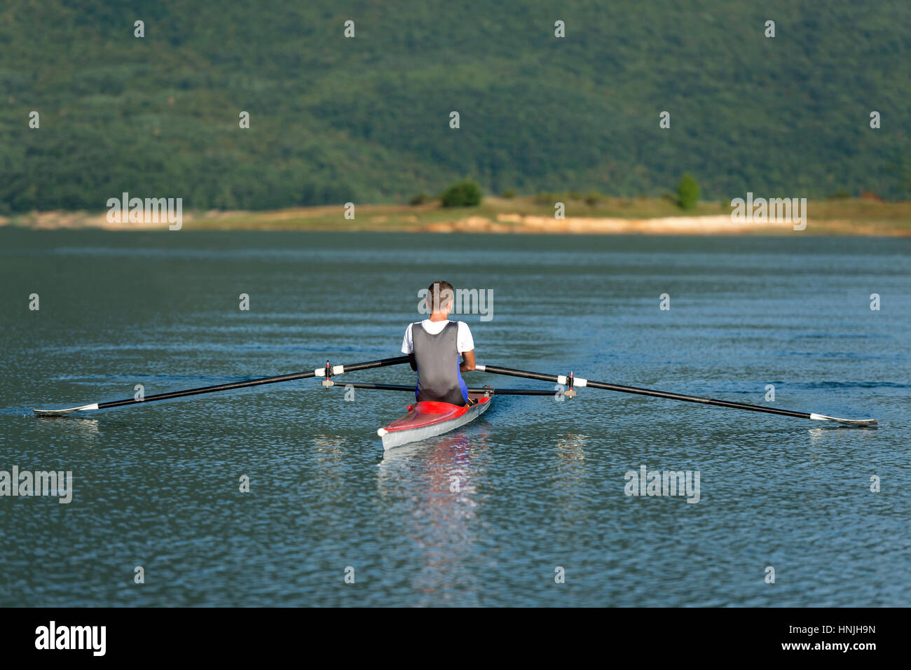 Child in the course of rowing on single Stock Photo - Alamy