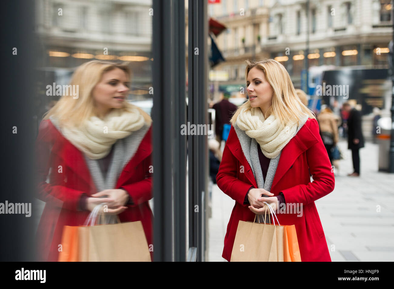Woman window shopping in centre of the city. Winter Stock Photo - Alamy