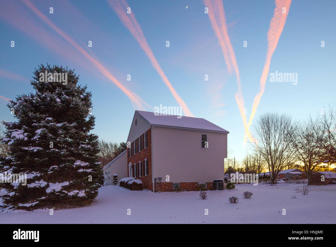 A snowy winter landscape with a house, blue sky, crescent moon, and ... A snowy winter landscape with a house, blue sky, crescent moon, and ...