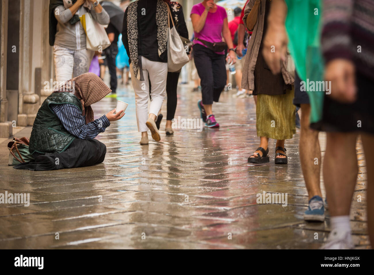 Beggar in the shopping center of Venice.It gets a greater problem in ...