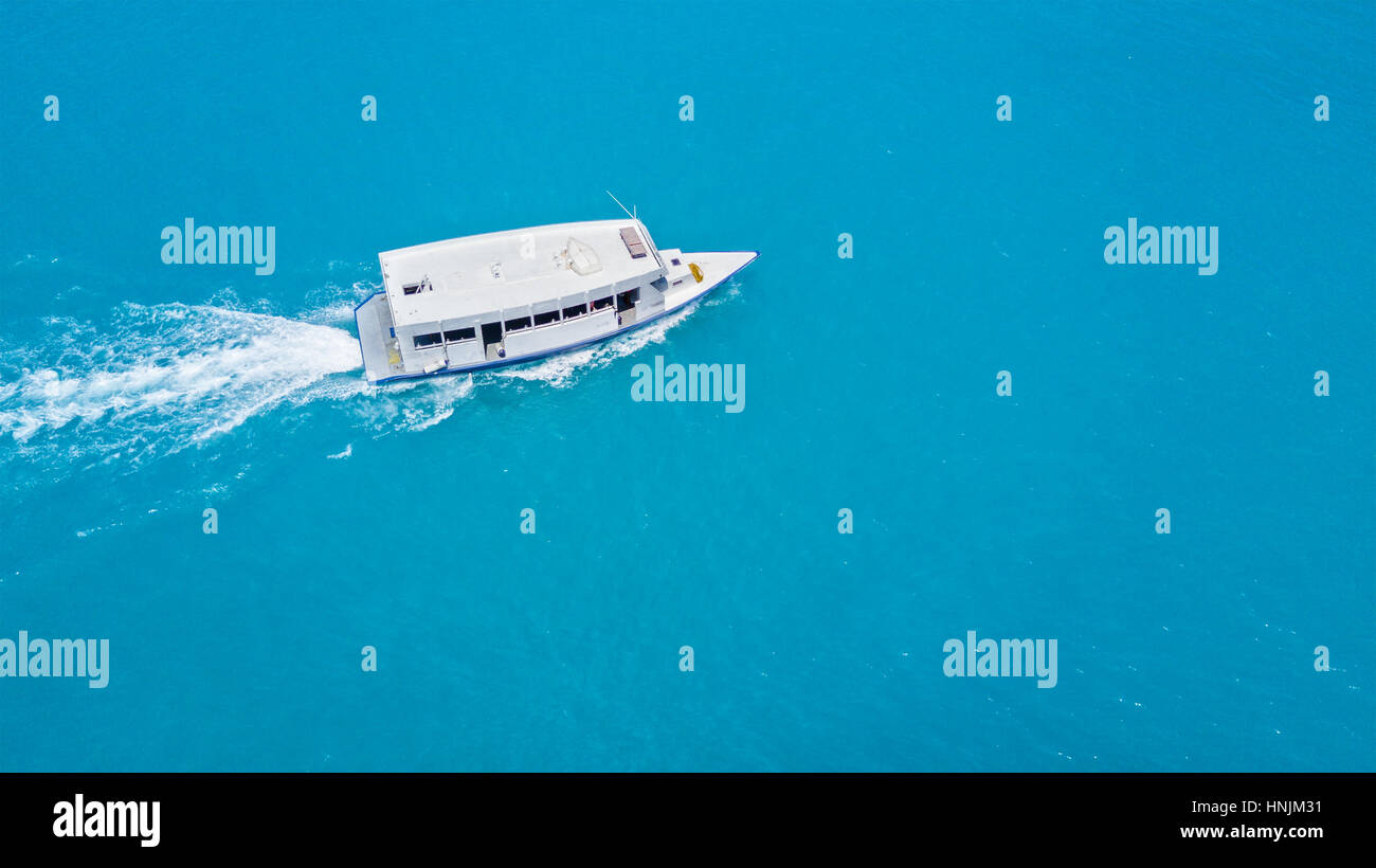 Aerial view of small boat flowing in sea, travel and vacation concept ...