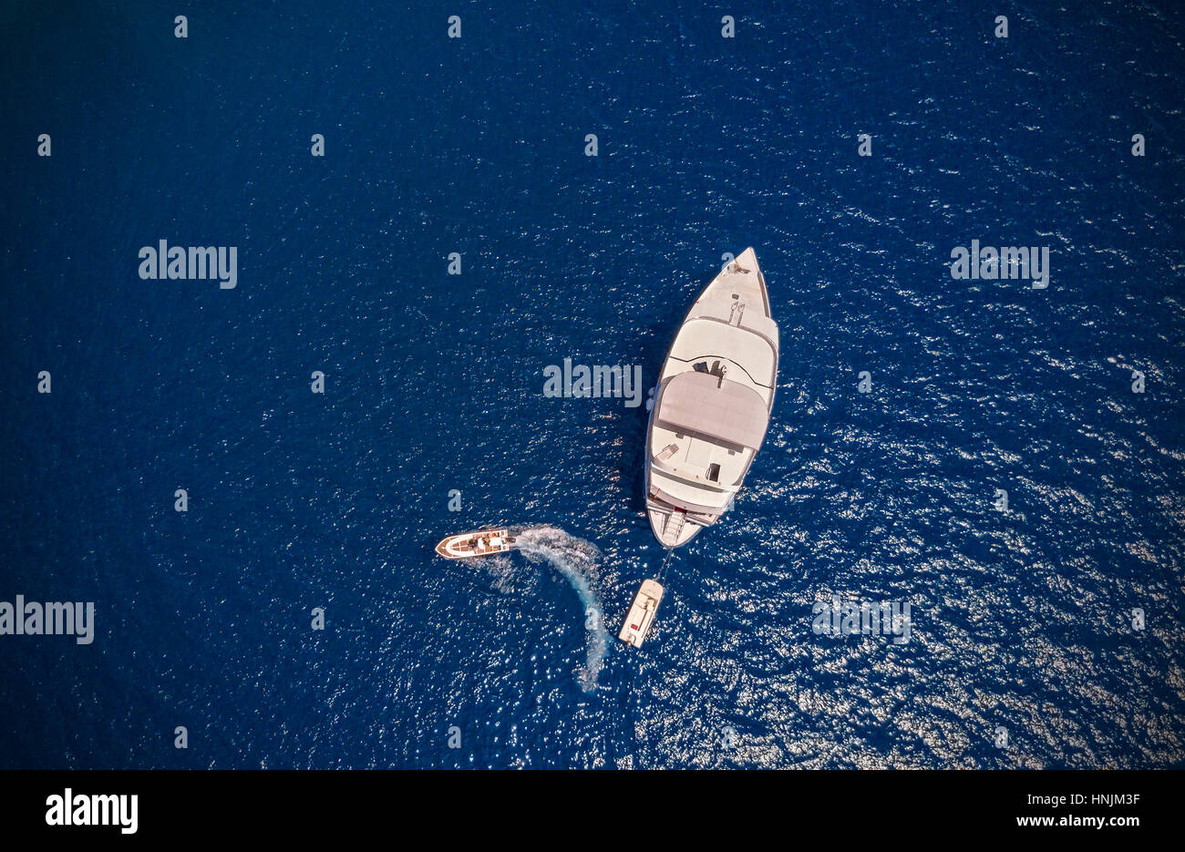 Small yacht moving in sea hi-res stock photography and images - Alamy