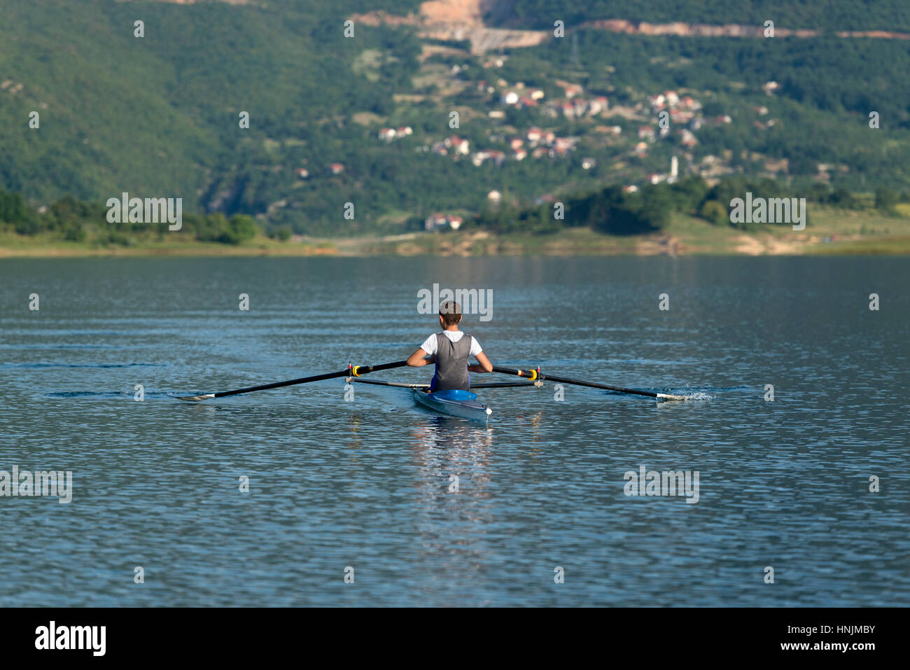 Child in the course of rowing on single Stock Photo - Alamy