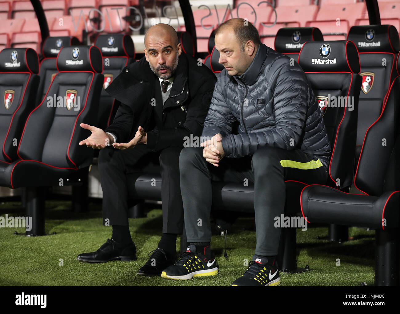Manchester City manager Pep Guardiola (left) with head of coaching ...
