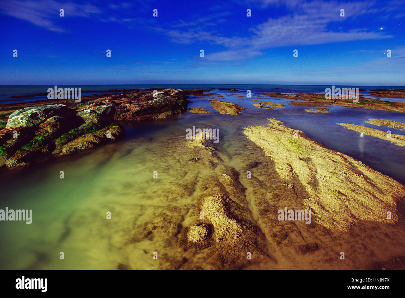 Fantastic views of the sea with corals and night sky Stock Photo - Alamy