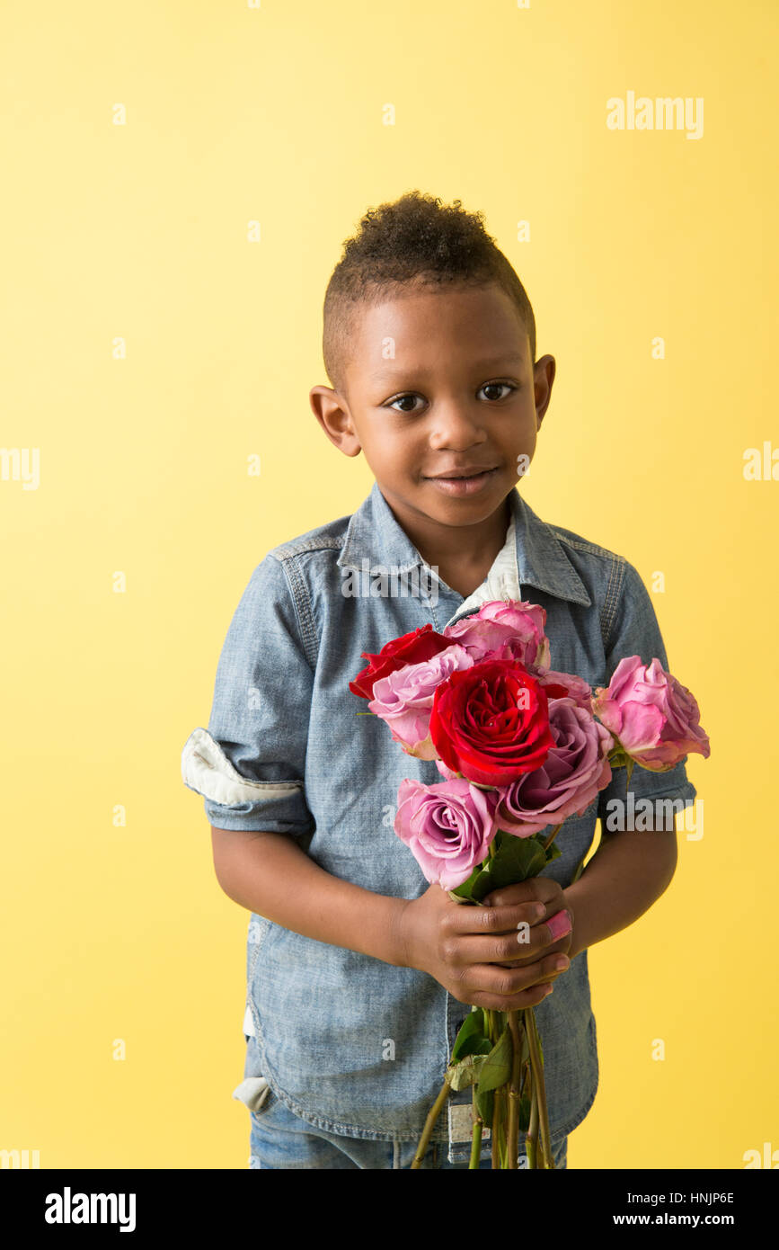 boy holding roses Stock Photo - Alamy