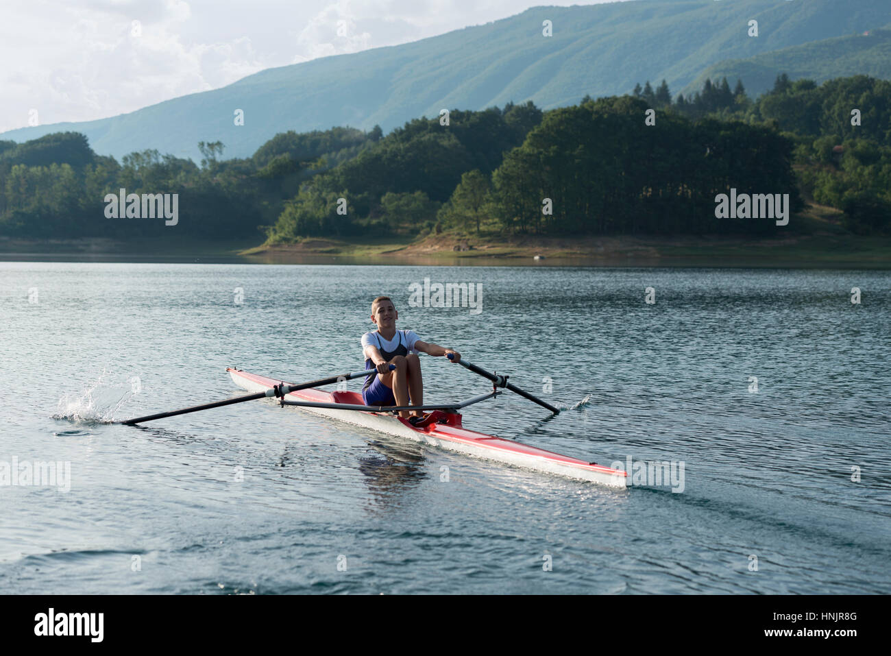 Child in the course of rowing on single Stock Photo - Alamy