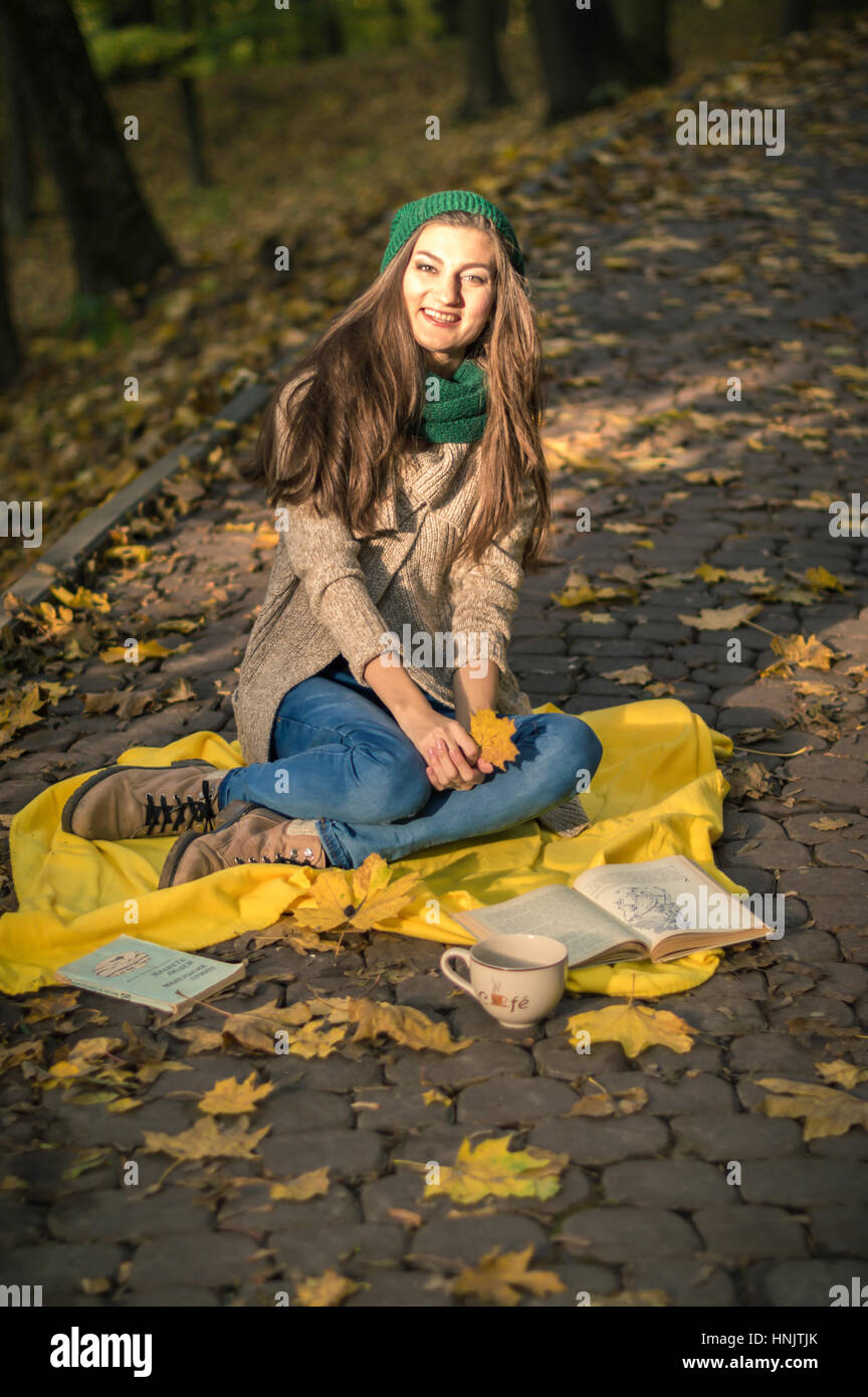 girl sitting on the track Stock Photo - Alamy