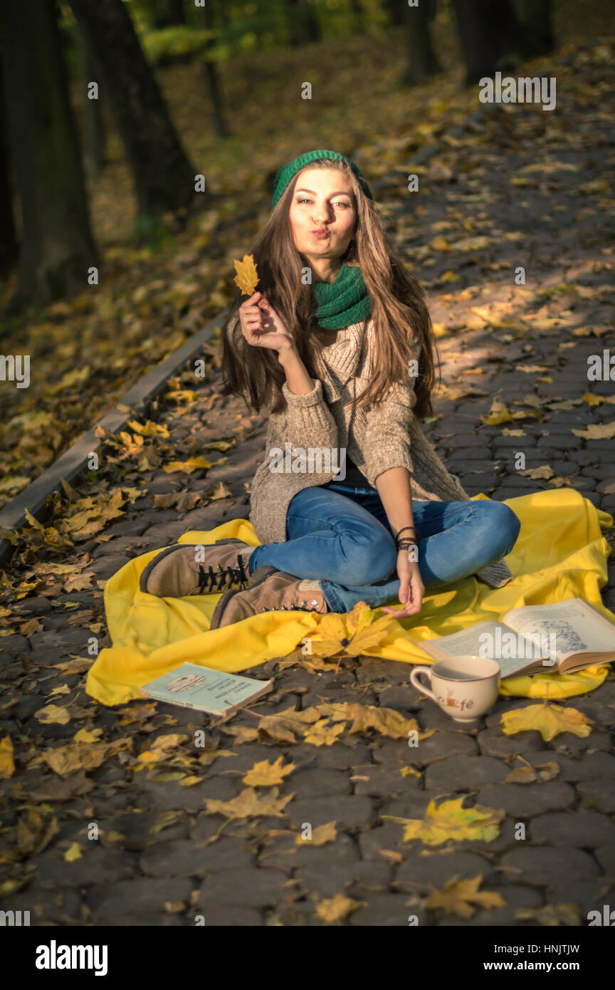 girl sitting on the track Stock Photo - Alamy