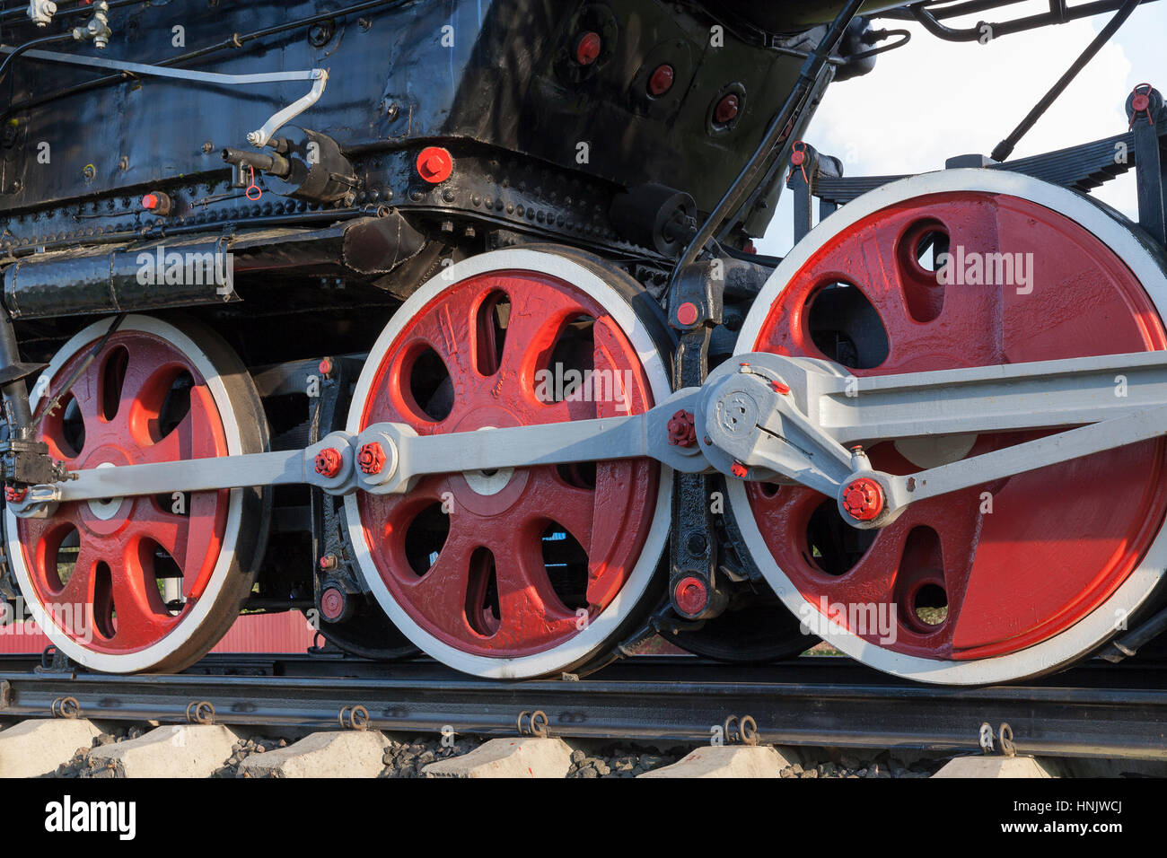 photographed close up an old steam locomotive wheels with black painted ...