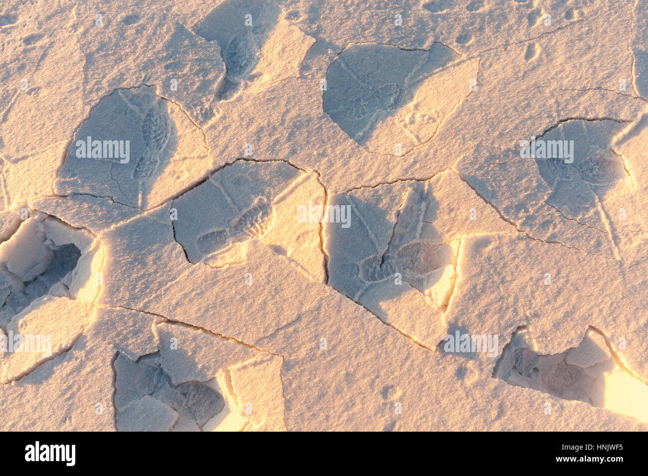 broken layer of snow after the person has passed through it ...