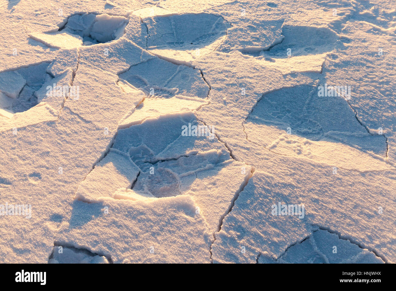 broken layer of snow after the person has passed through it ...