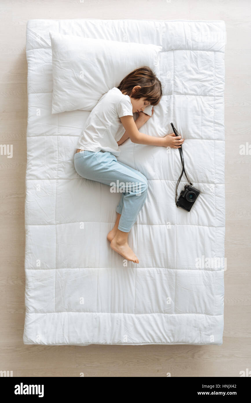 Little photographer taking a nap Stock Photo - Alamy