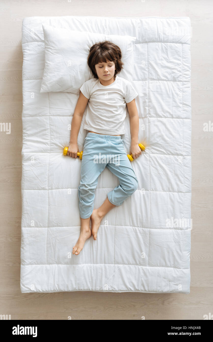 Lazy cute boy having a nap in the morning Stock Photo - Alamy